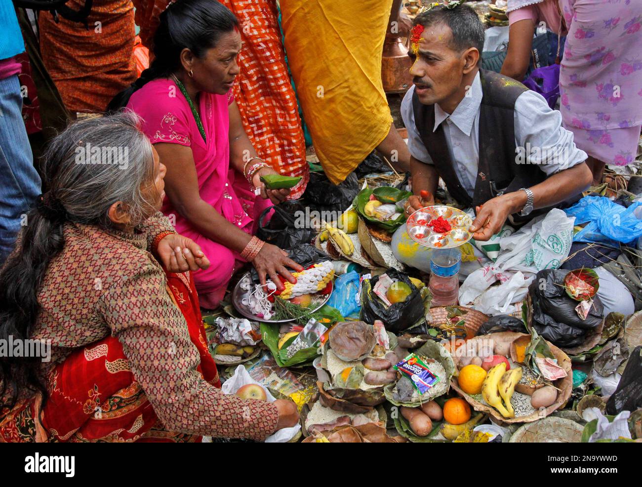 A Hindu priest performs rituals during Matatirtha Aunshi, or Mother's ...