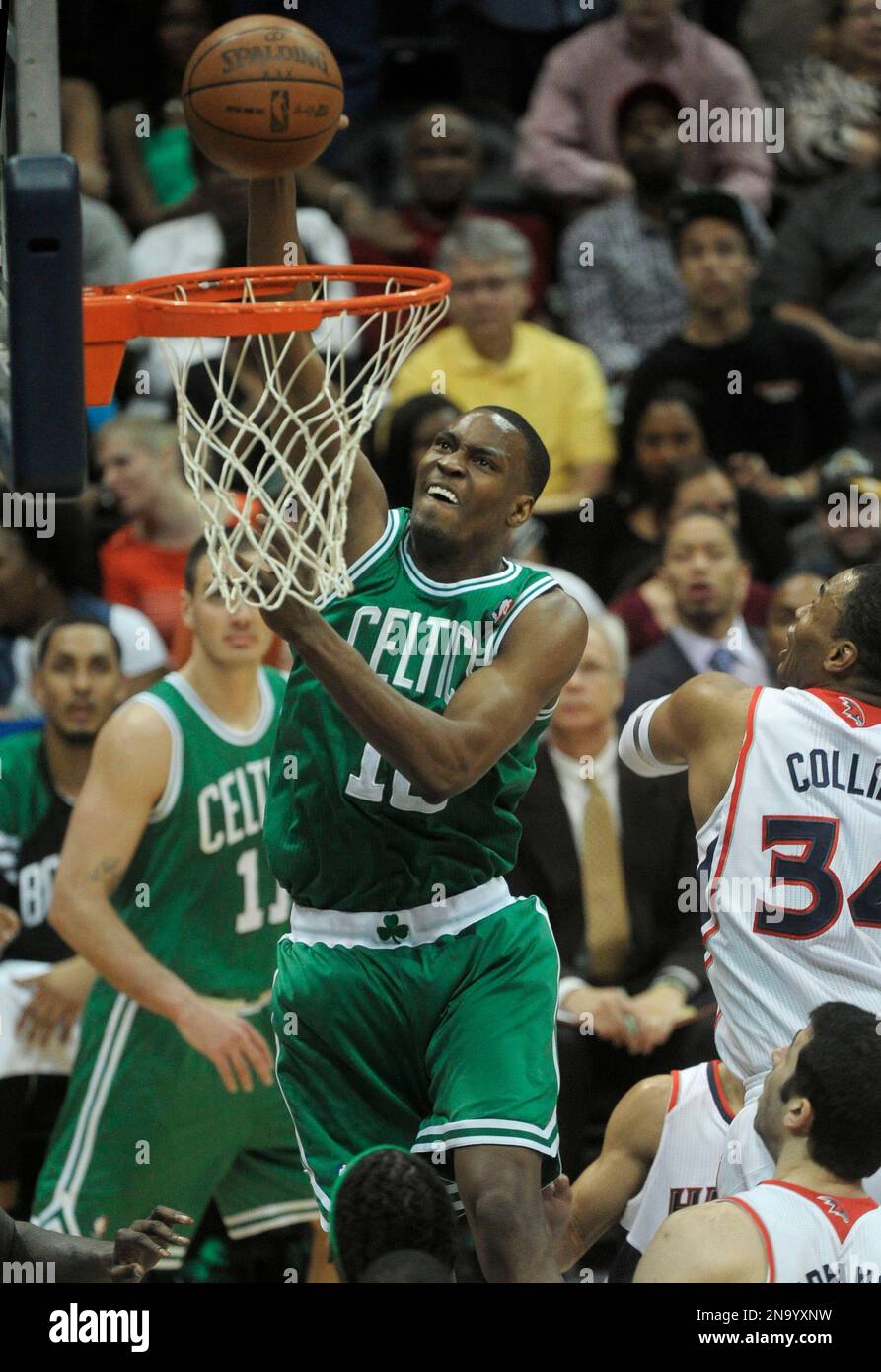 Boston Celtics forward JaJuan Johnson (12) takes the ball to the basket ...