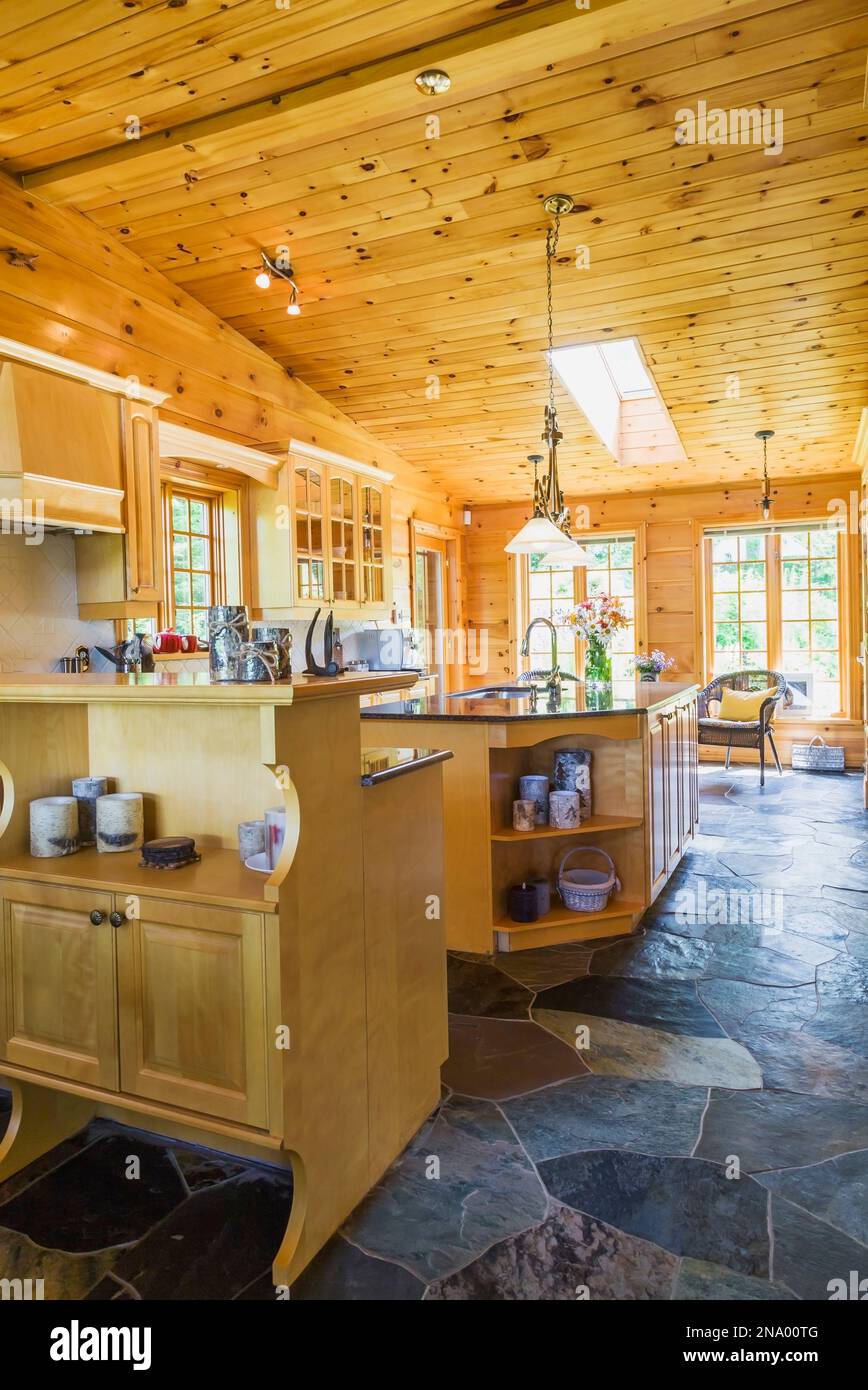 Maple wood buffet, island with polished granite countertop and ...