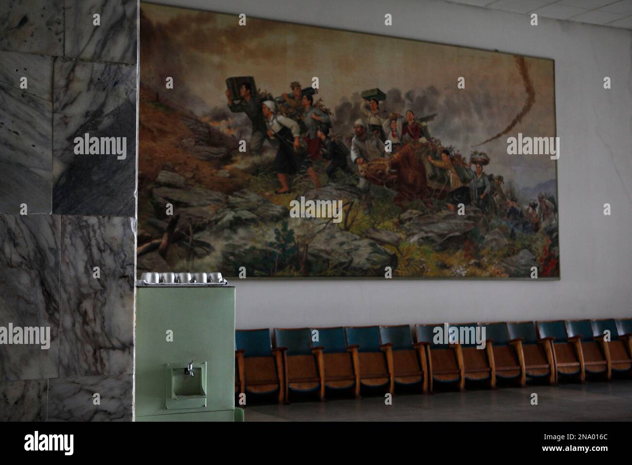 A painting depicts refugees from war at the War Museum in Pyongyang ...