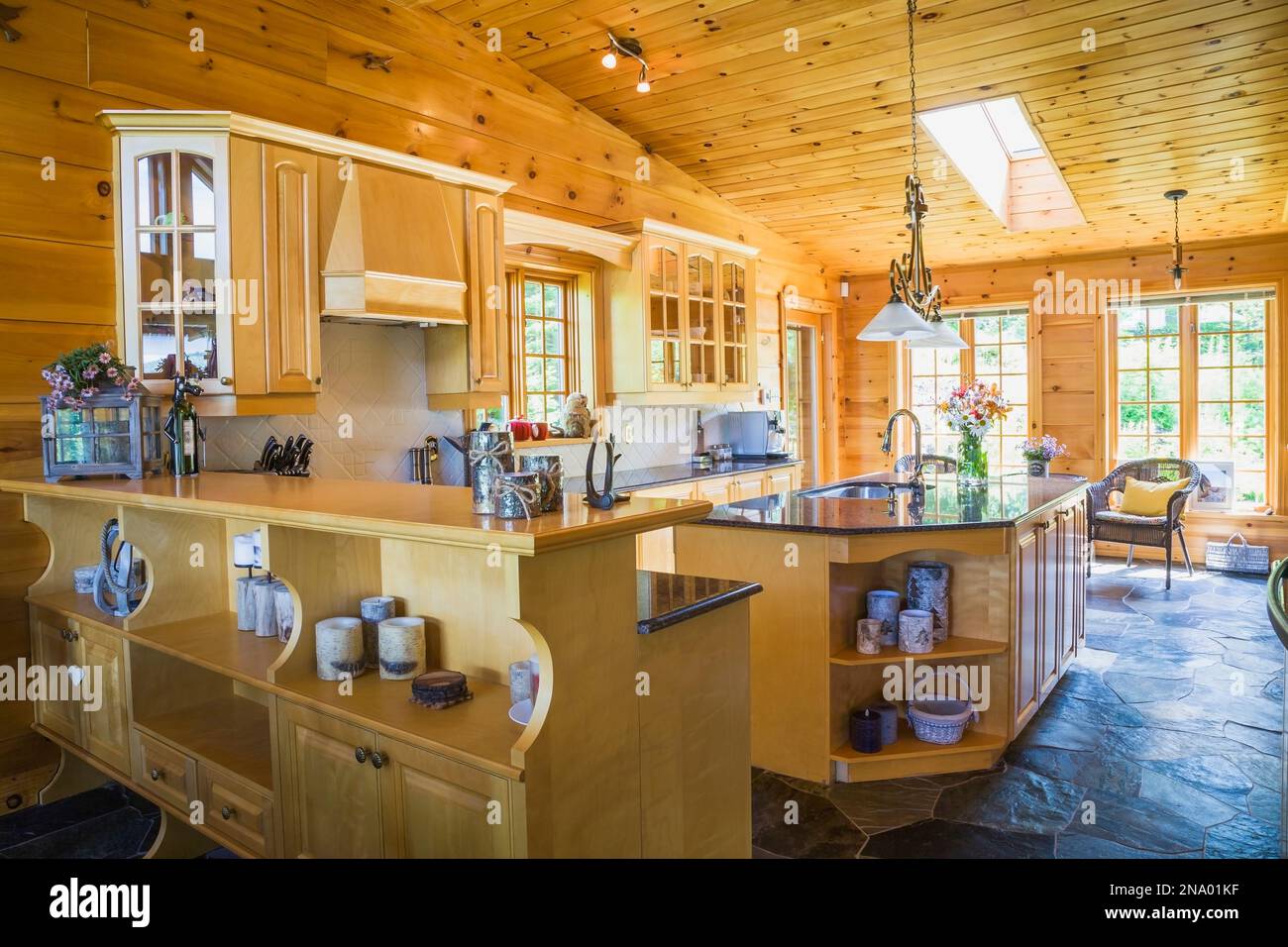 Maple wood buffet, island with polished granite countertop and ...