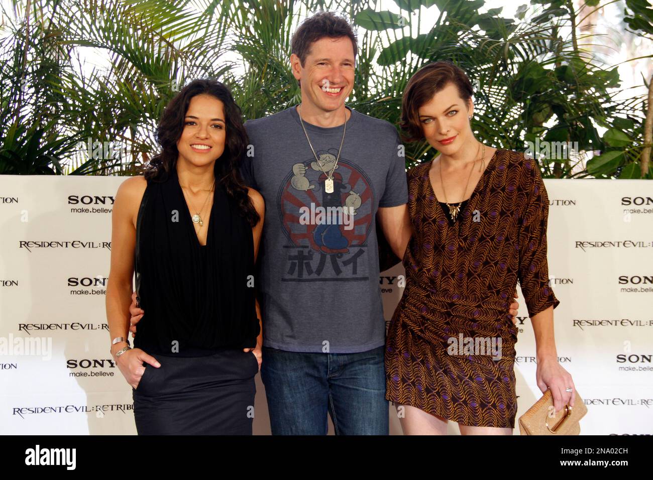 Ukranian-born actress Milla Jovovich, right, poses for the press with ...