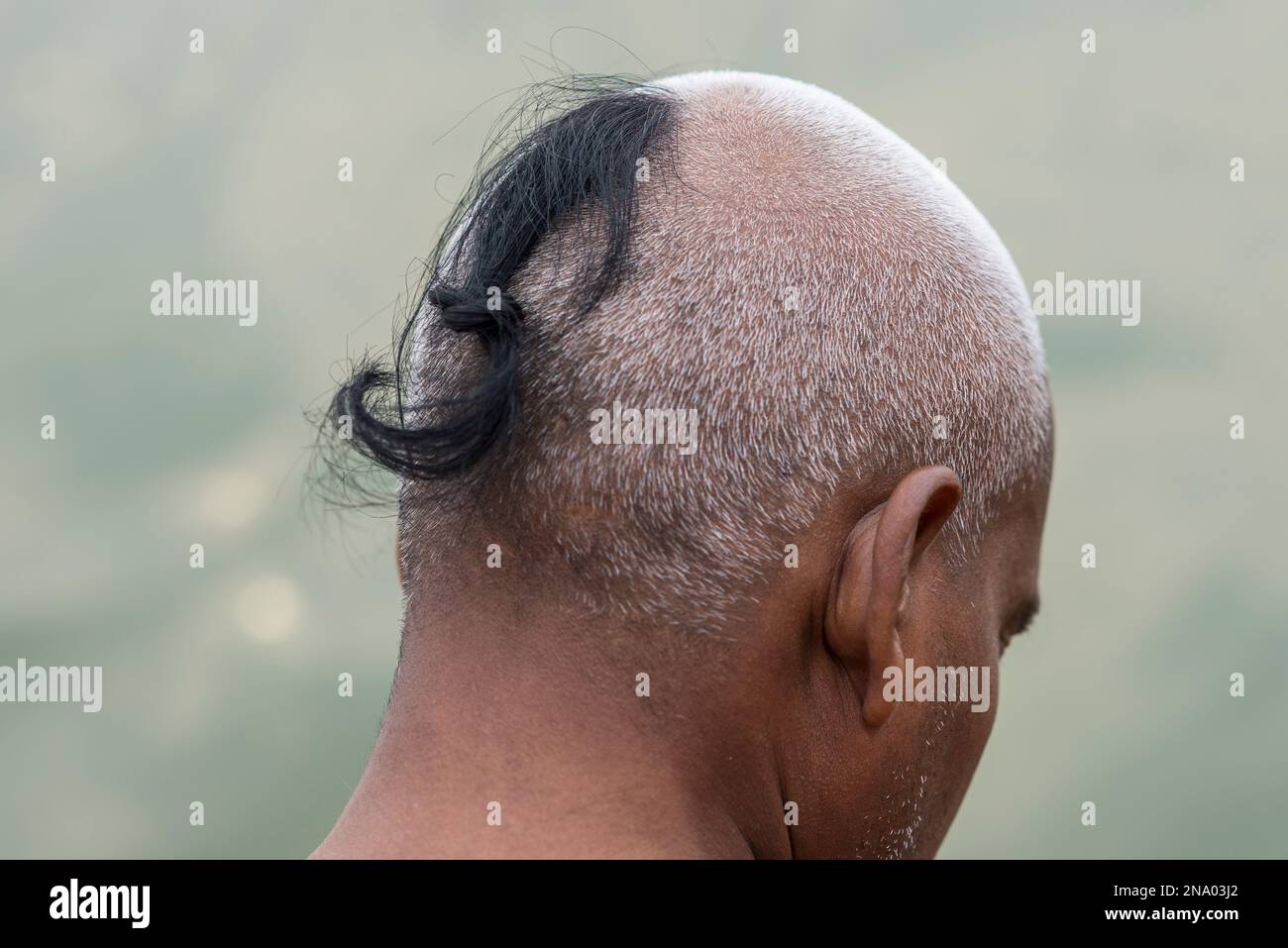 Pilgrim with shaven head Stock Photo - Alamy