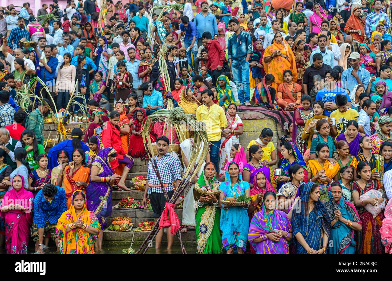 Pilgrims celebrating Chhath Puja by the Ganges Stock Photo - Alamy