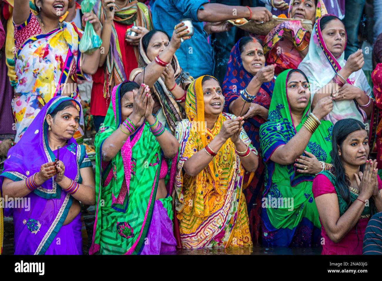 Pilgrims celebrating Chhath Puja by the Ganges Stock Photo - Alamy