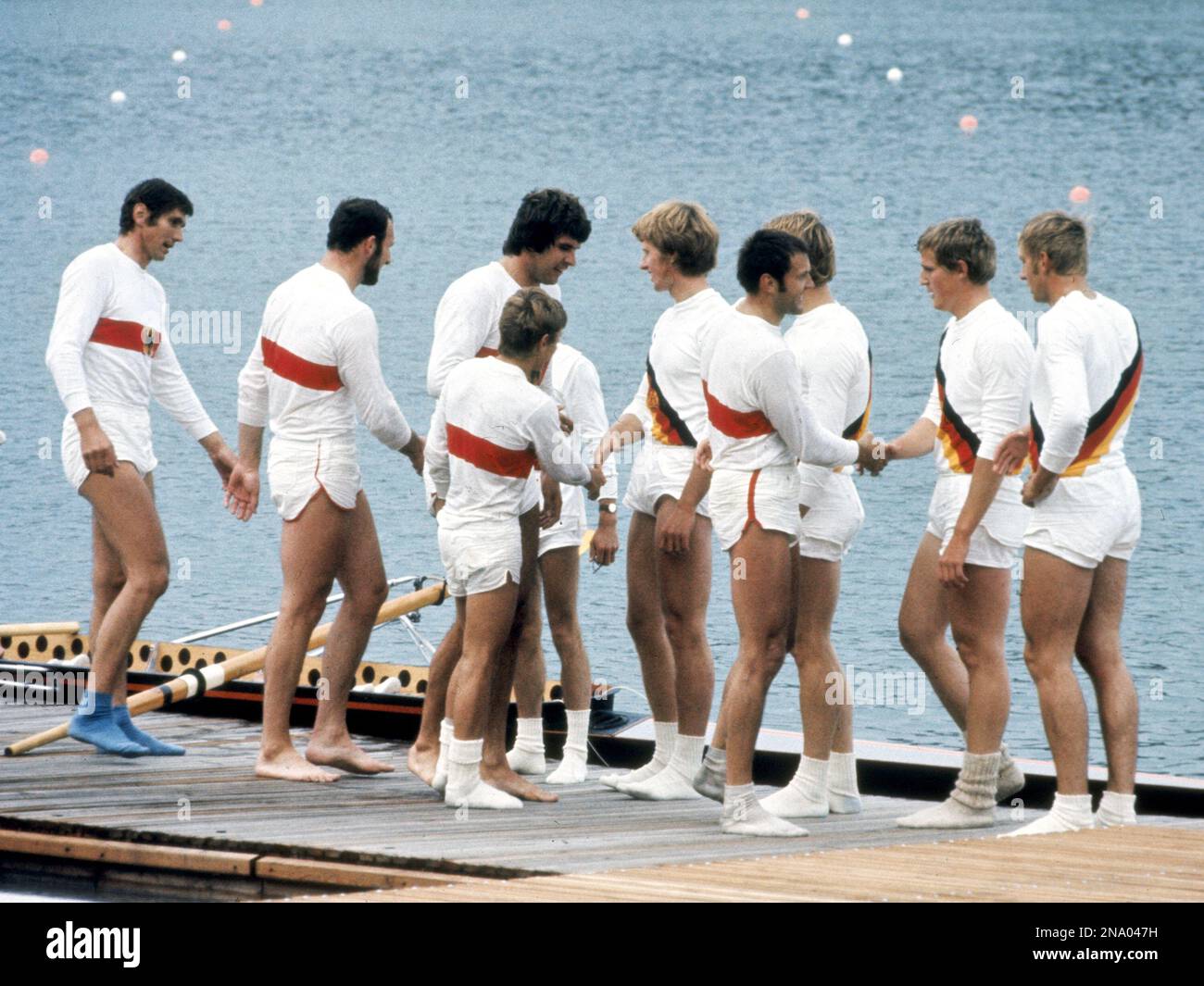 East and West German coxed fours rowing teams congratulate each other ...