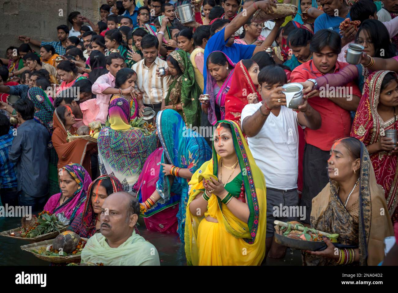 Pilgrims celebrating Chhath Puja by the Ganges Stock Photo - Alamy