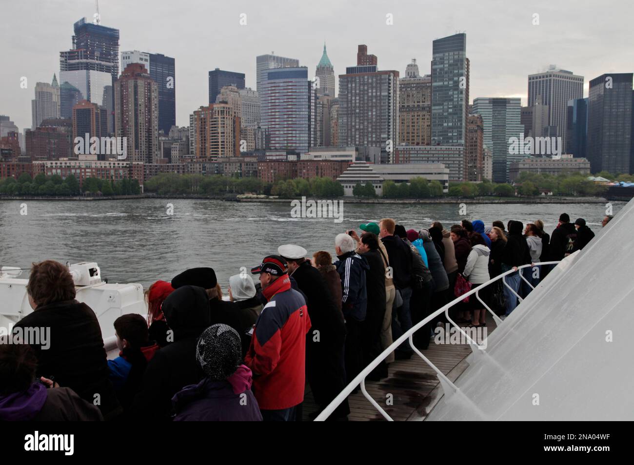 Backdropped by the Manhatan skyline, passengers watch as the MS ...
