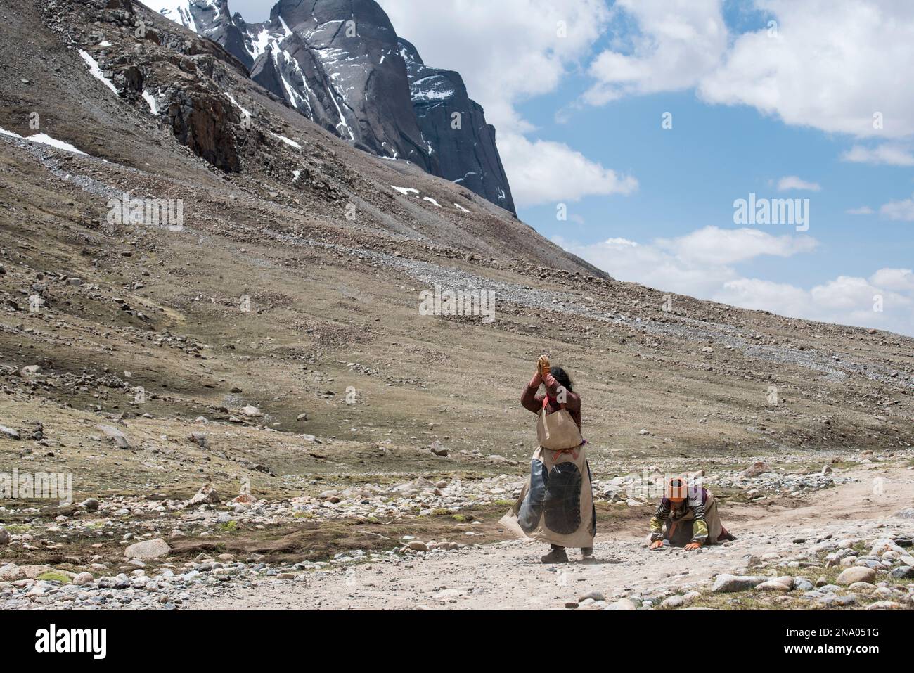 Pilgrims prostrating around Mount Kailash Stock Photo - Alamy