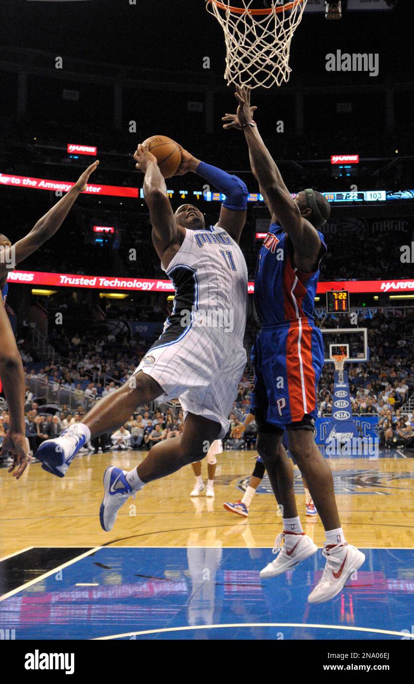 Orlando Magic center Glen Davis, left, puts up a shot in front of ...