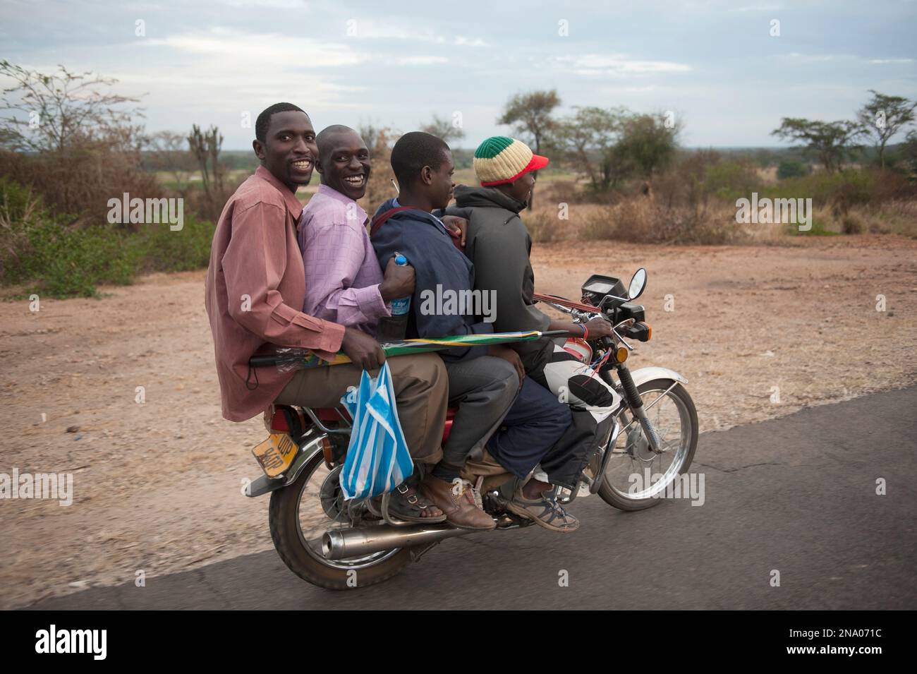 A motorcycle taxi near the town of Kasese in Uganda; Kasese, Uganda ...