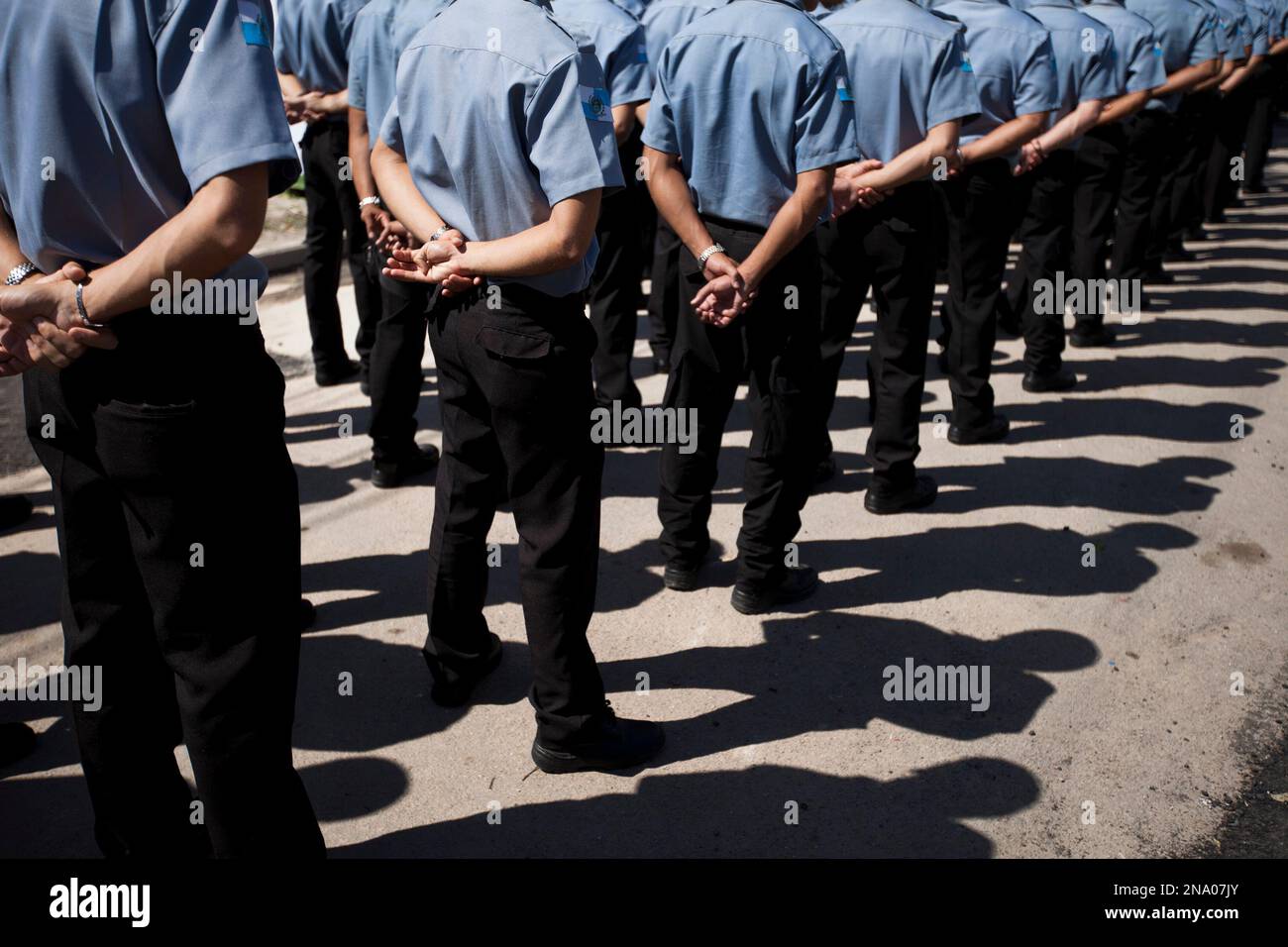 Policemen from the Peacemaker Police Unit (UPP) stand in formation ...