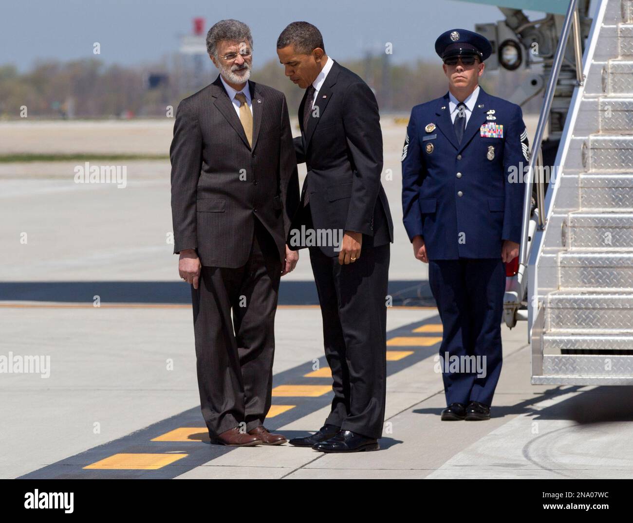 President Barack Obama is greeted by Cleveland Mayor Frank Jackson as ...