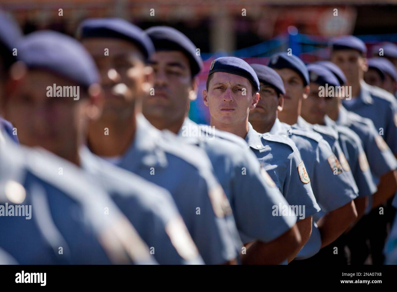 Policemen from the Peacemaker Police Unit (UPP) stand in formation ...
