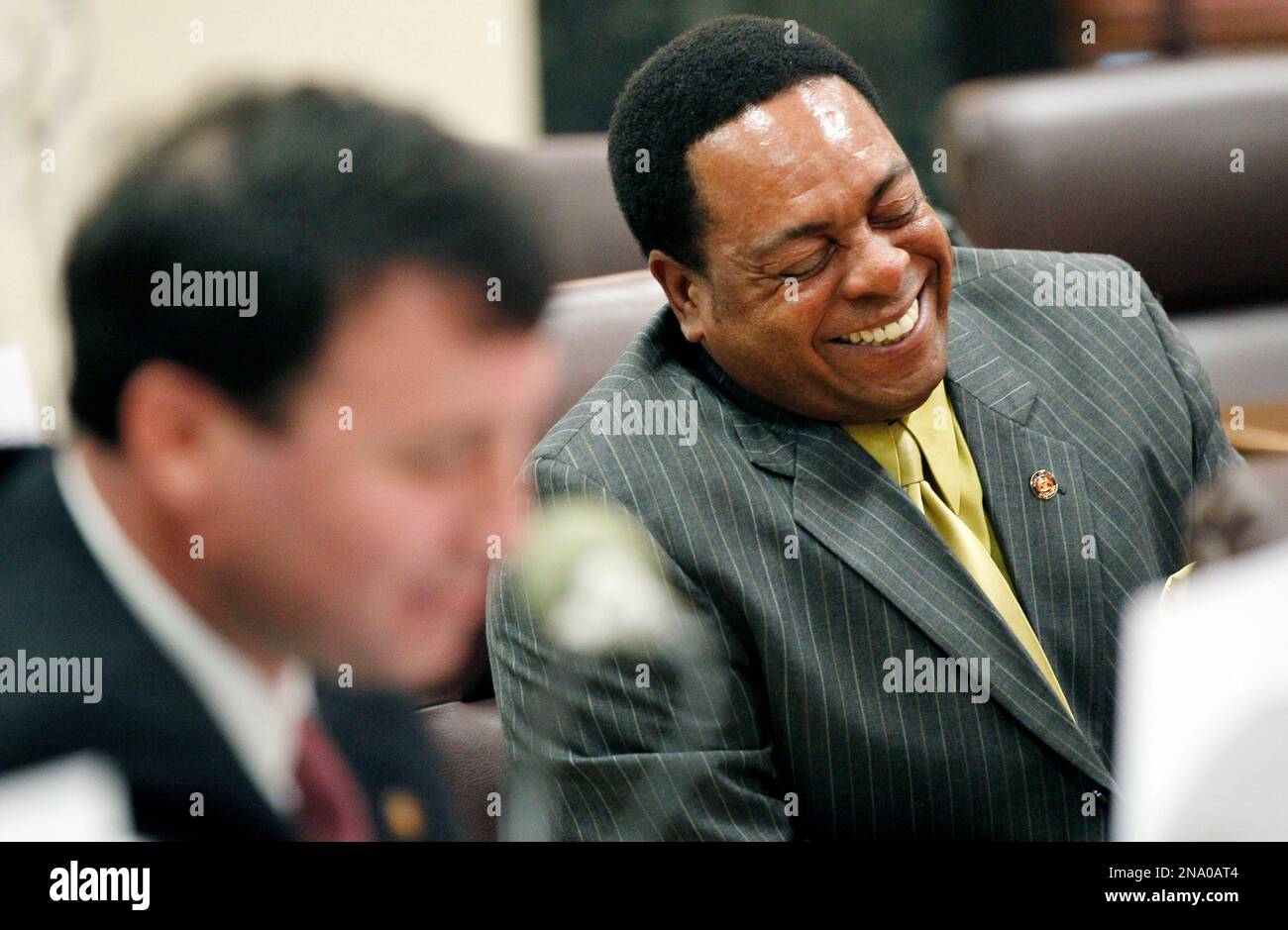 Sen. Kenneth Wayne Jones, D-Canton, laughs as Sen. Sean Tindell, R ...