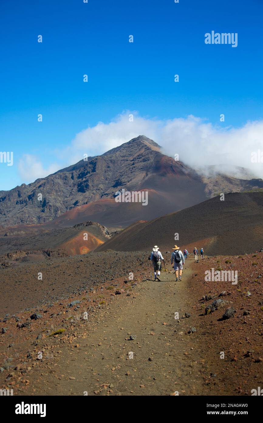 Hikers on Sliding Sands trail in Haleakala Crater, Maui, Hawaii MNR ...