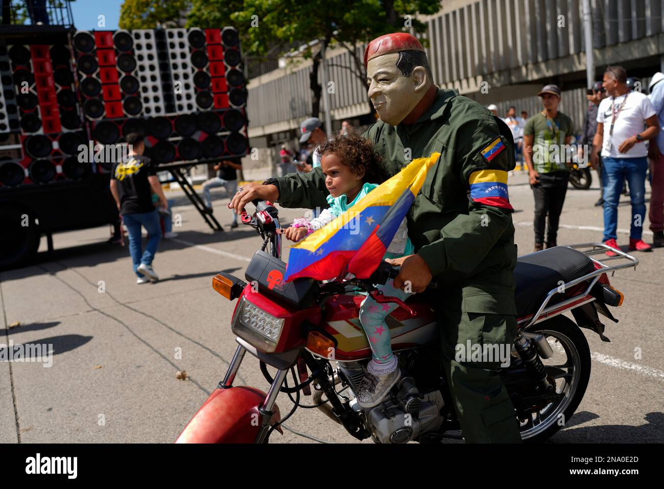 A pro-government supporter wearing a mask of late President Hugo Chavez ...