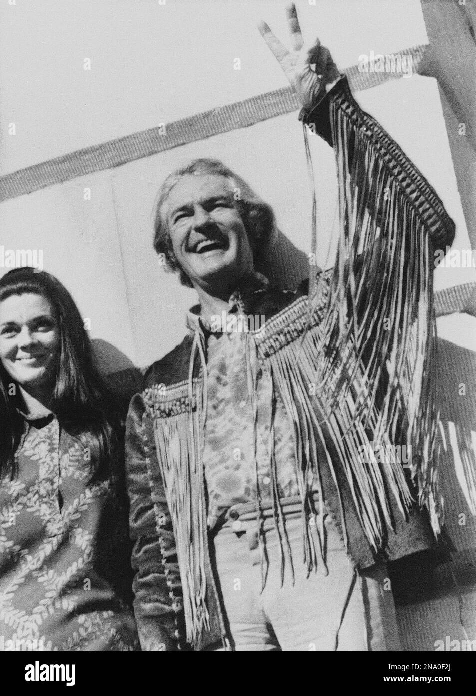 Dr. Timothy Leary gives passersby the peace sign in Laredo, Texas, Jan ...