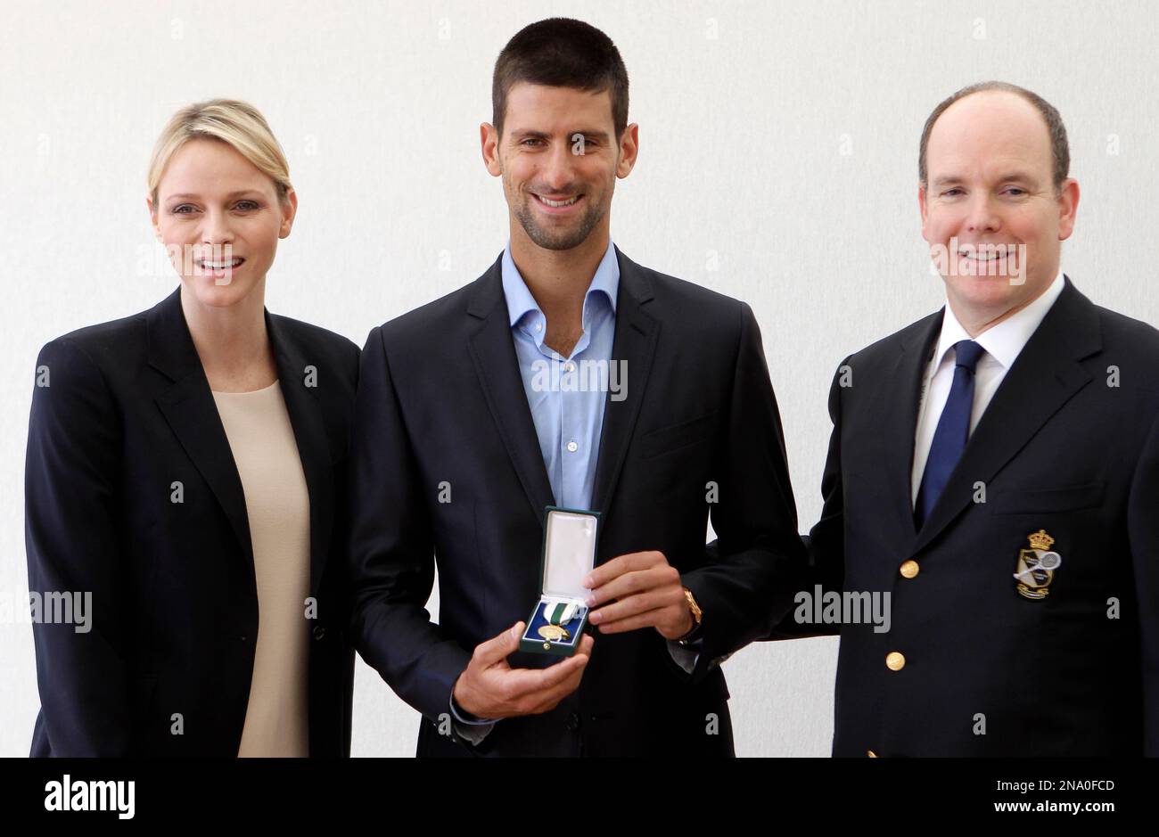 Prince Albert II of Monaco, right, with his wife Princess Charlene ...