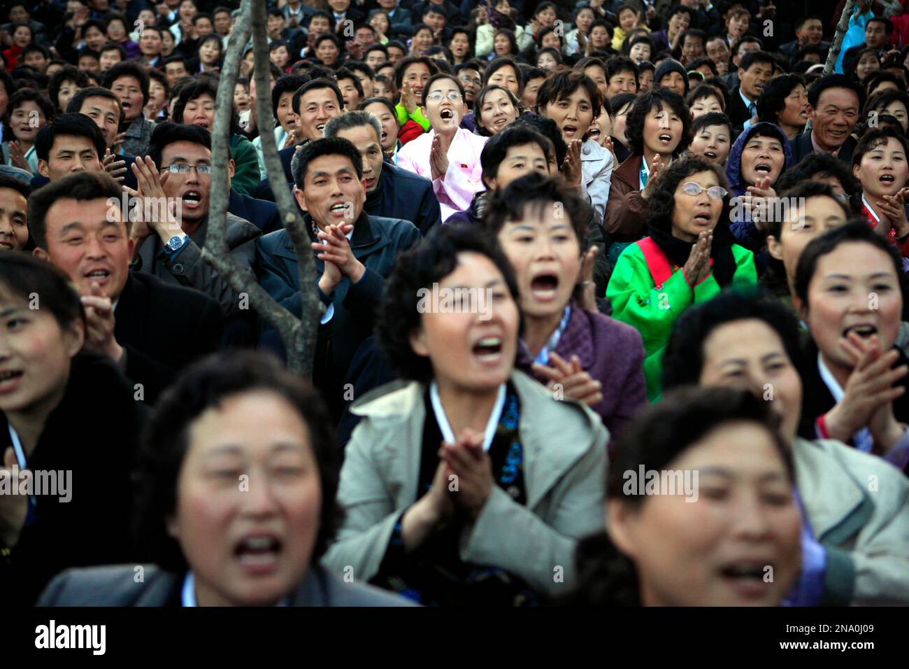 North Koreans sing before a firework display at the Taedong River in ...