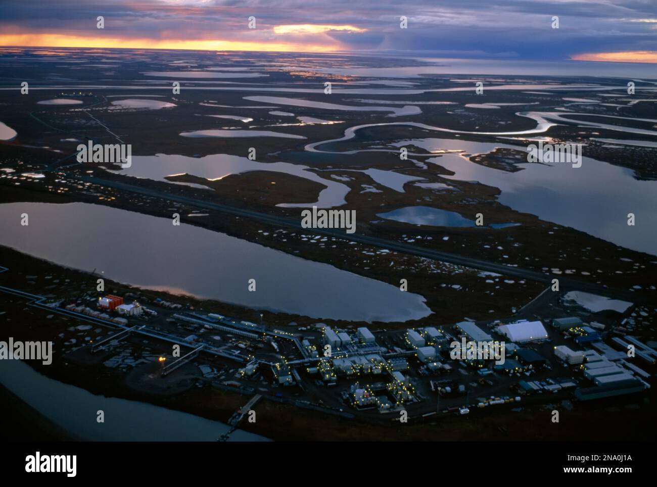 Aerial view of the oil field's settlement surrounded by delta ponds ...