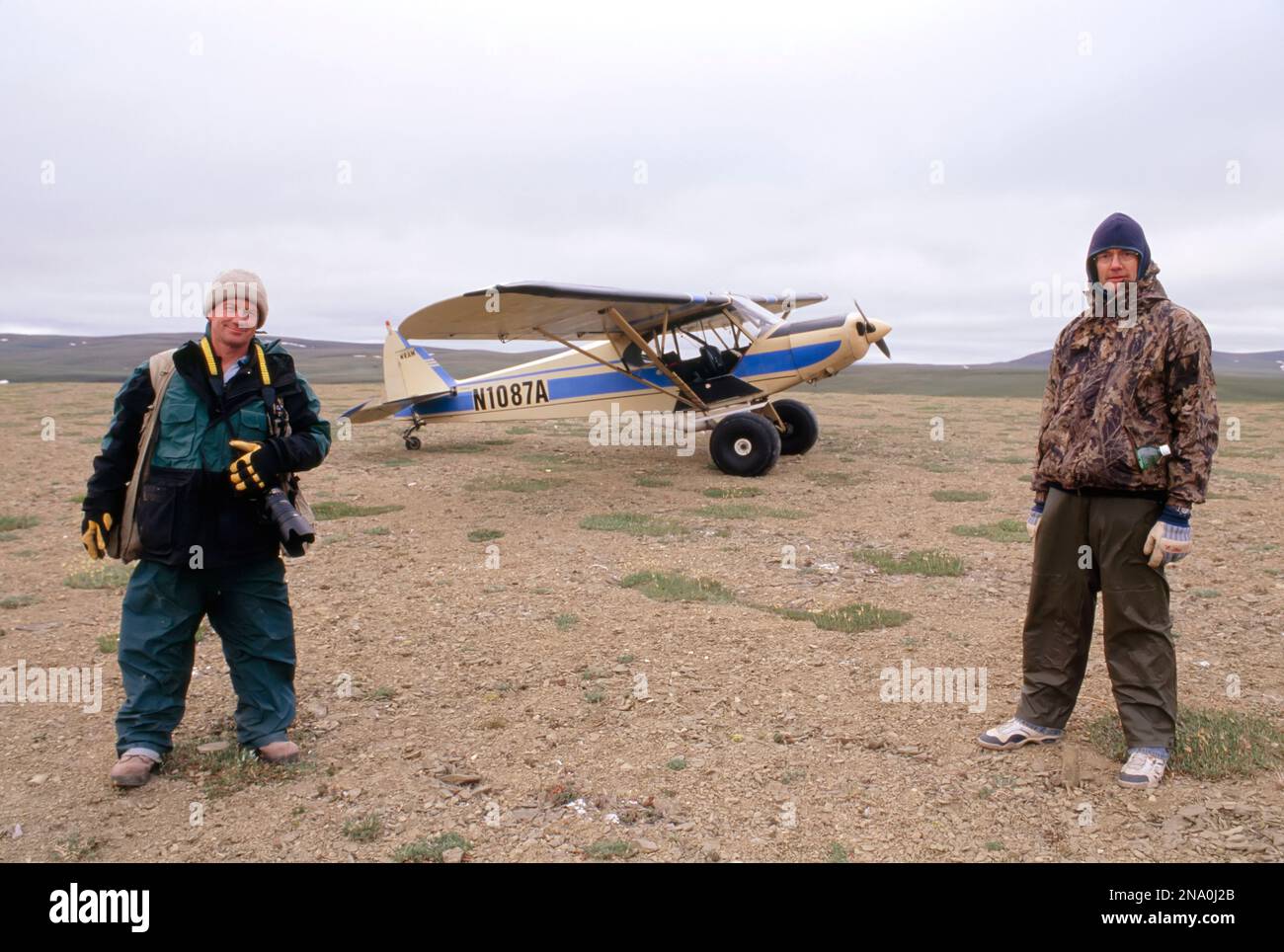 Passenger and pilot in Alaska's North Slope area, USA; North Slope ...