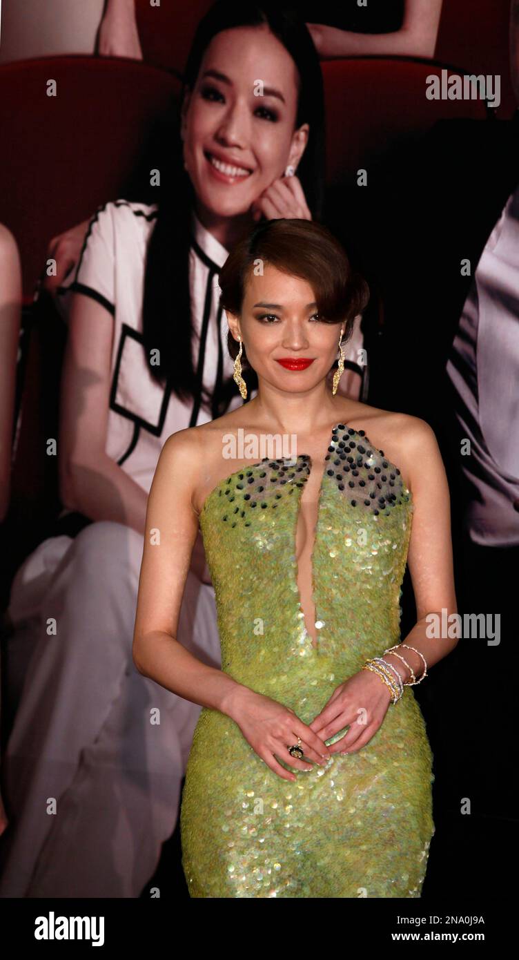 Taiwan actress Shu Qi poses in front of her poster on the red carpet of ...