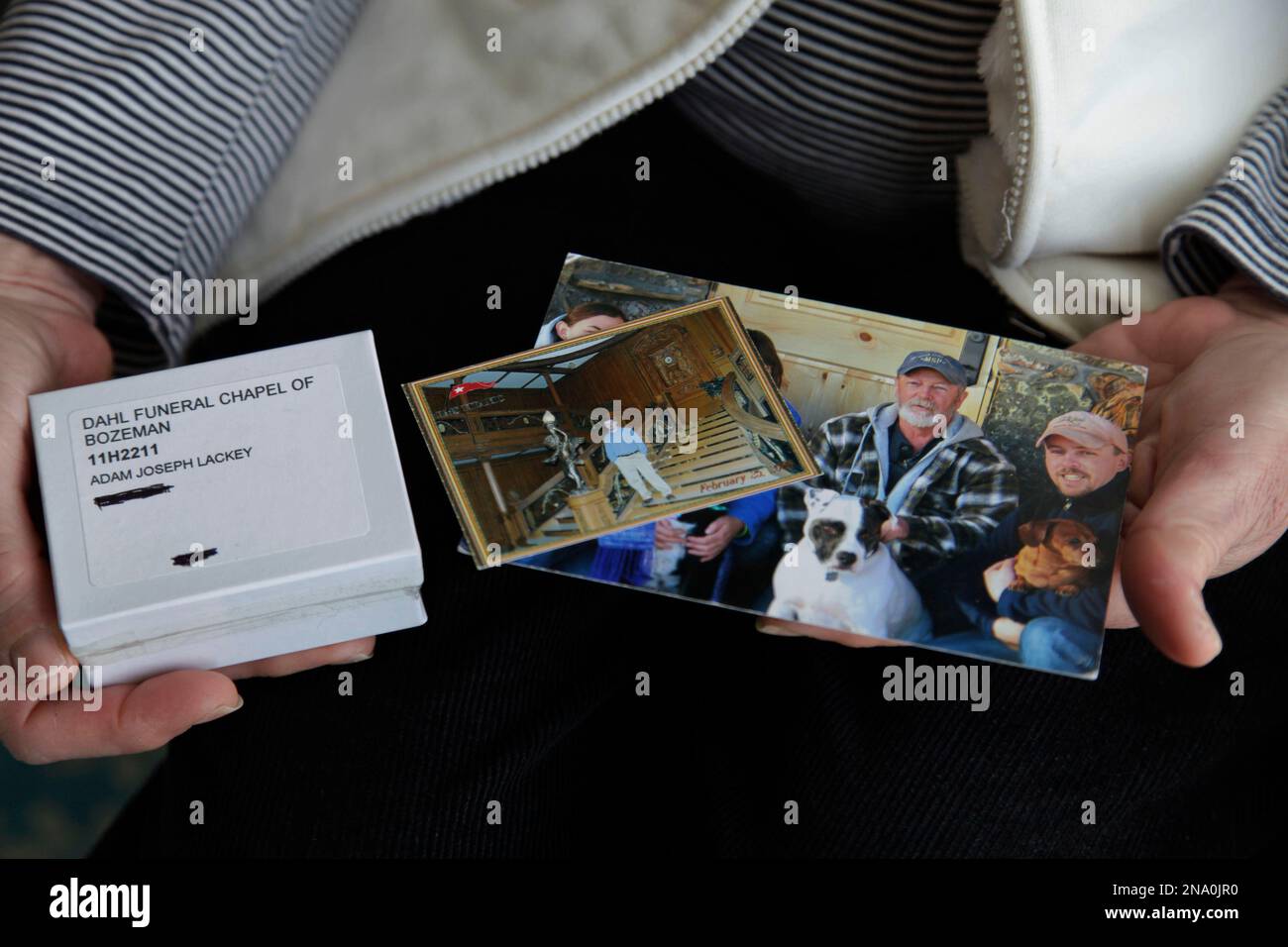 Helen Edwards, 62, from Silver Spring, Maryland holds a box with ashes ...