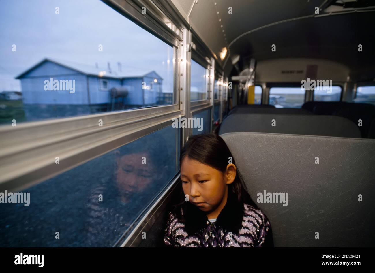An Inuit girl alone on a bus; North Slope, Alaska, United States of ...