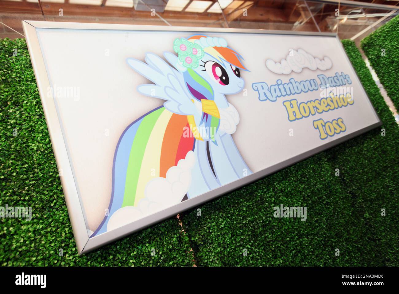 Guests play horseshoes at "Rainbow Dash's Horseshoe Toss" at The Hub TV ...