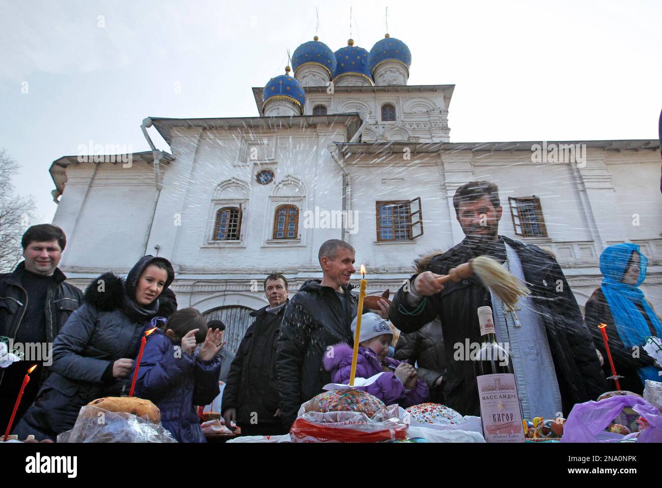 An Orthodox priest blesses traditional Easter cakes and painted eggs ...