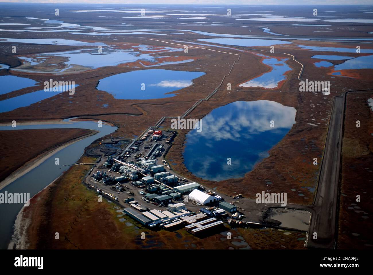 Aerial view of tundral rivers and an oil refinery, Northern Alaska ...