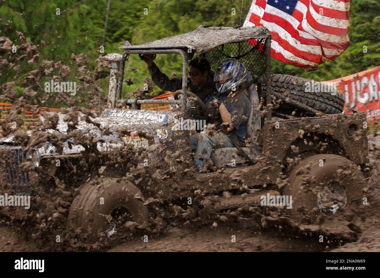 Drivers compete on a mud bog course with all-terrain vehicles; Alaska ...