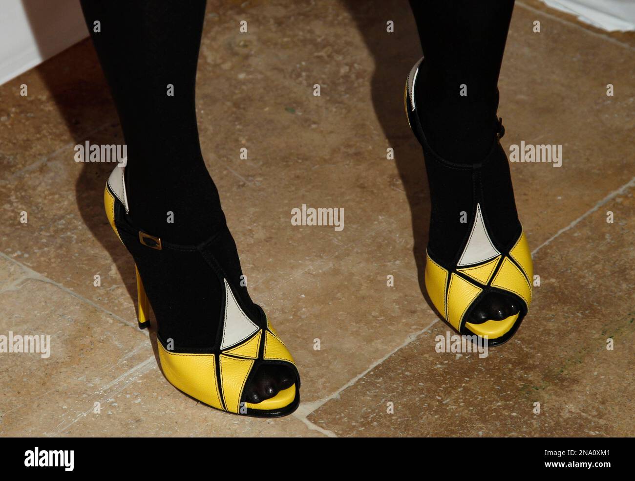 Shoes worn by actress Jessica Alba are seen as she poses at the Conde ...