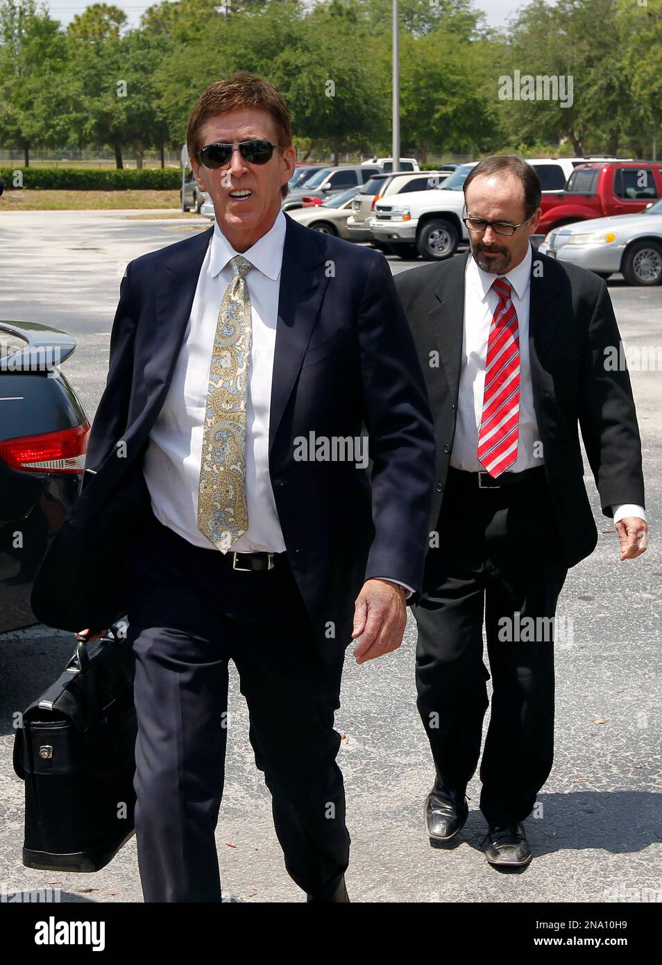 Attorney Mark O'Mara, left, and Jimmy Woods arrive for George Zimmerman ...