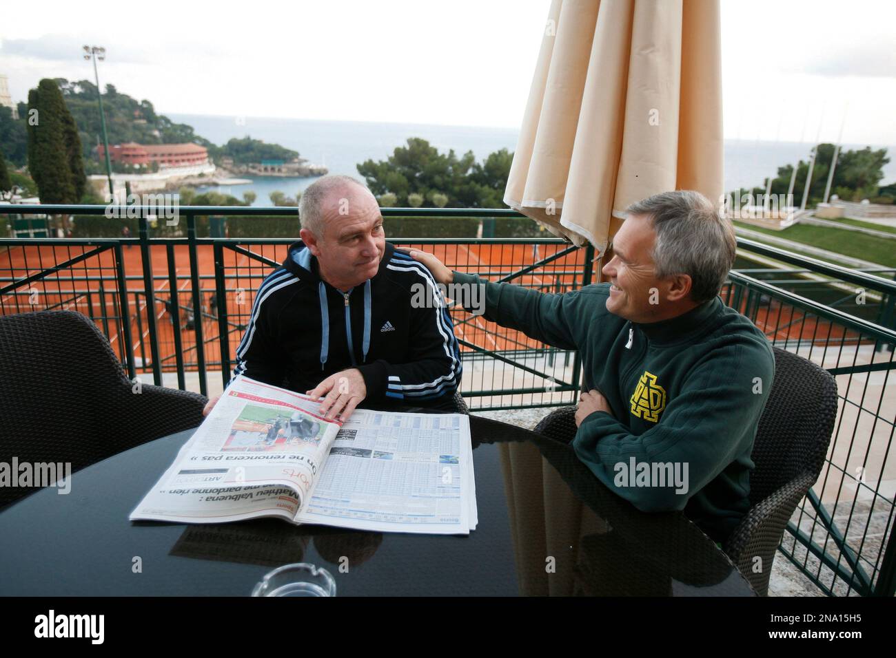 Spanish tennis coach Ricardo Sanchez (left) speaks with Piotr Wozniaki ...