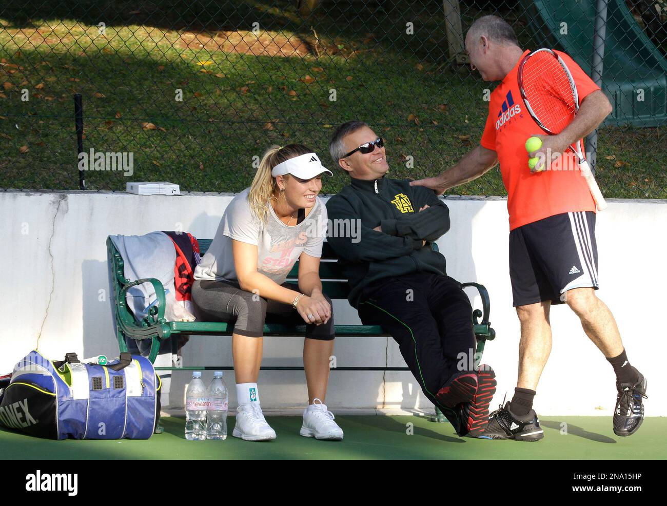 Spanish tennis coach Ricardo Sanchez (right) speaks with Piotr Wozniaki ...