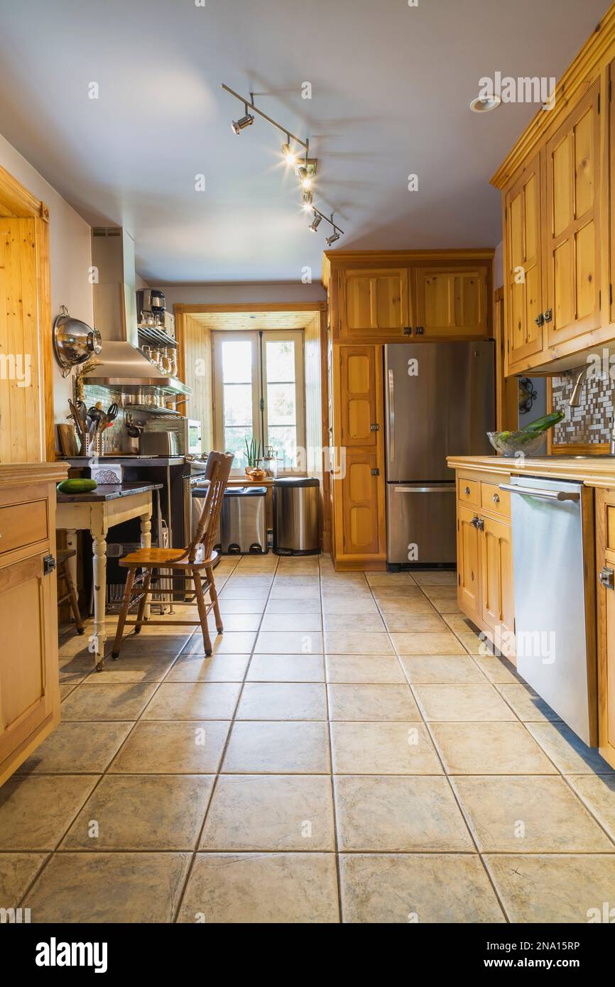 Pine wood cabinets and white antique breakfast table and chair plus ...