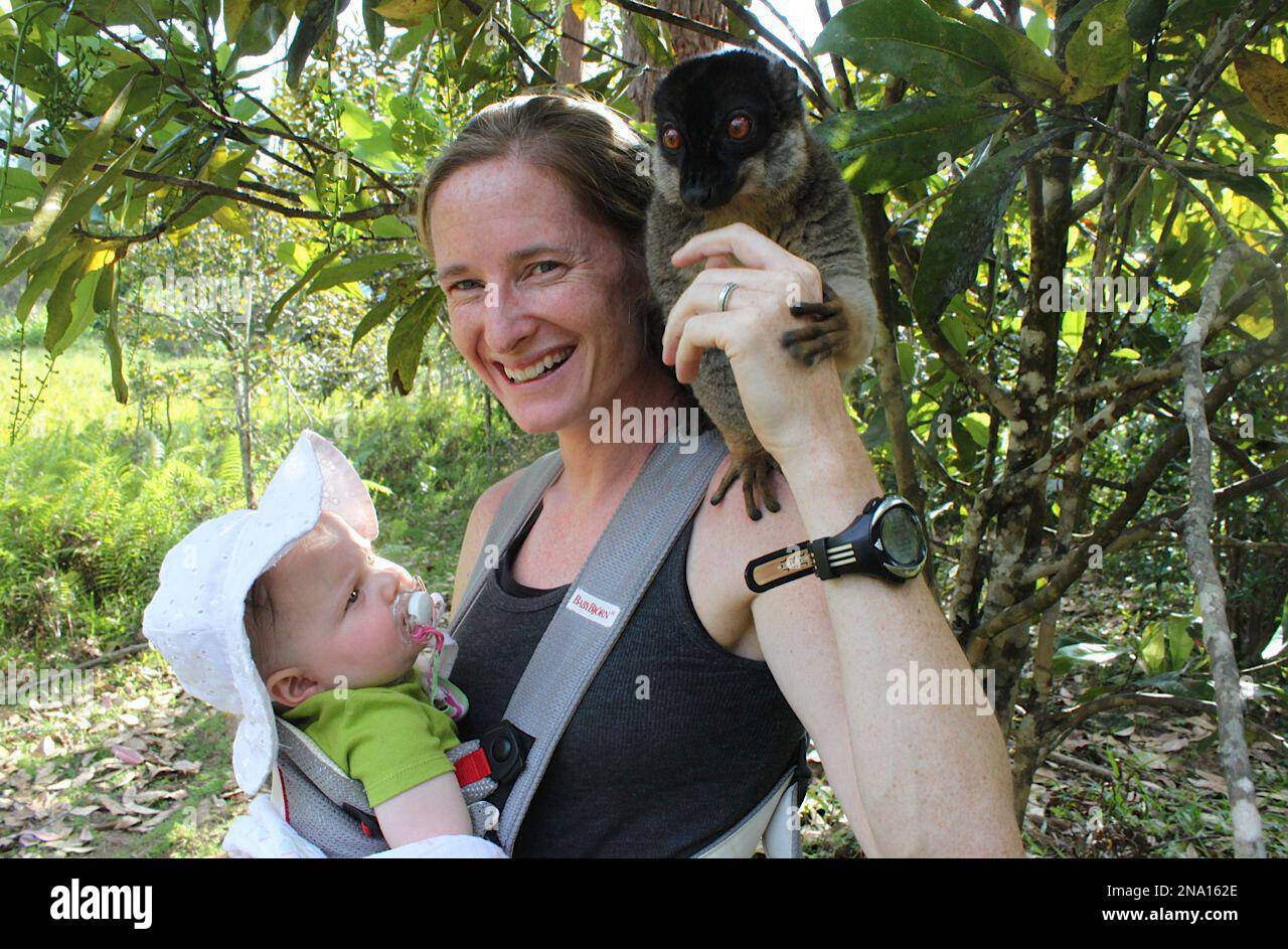 In this Dec. 13, 2011 photo, a lemur sits on the shoulder of Katie ...