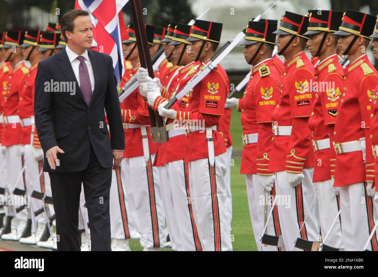 British Prime Minister David Cameron inspects honor guards prior to his ...
