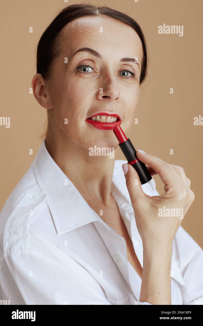 Modern 40 Years Old Woman With Red Lipstick In White Shirt Isolated On