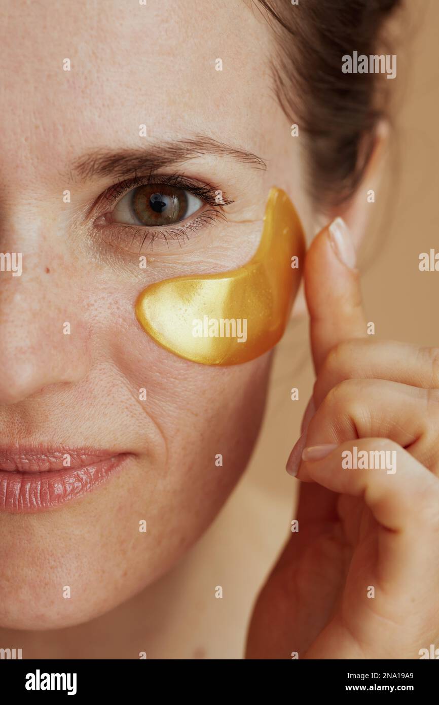Woman lifting eye mask hi-res stock photography and images - Alamy