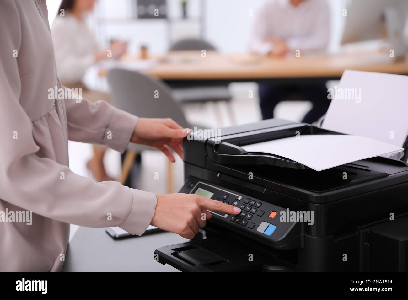 Employee using modern printer in office, closeup Stock Photo - Alamy