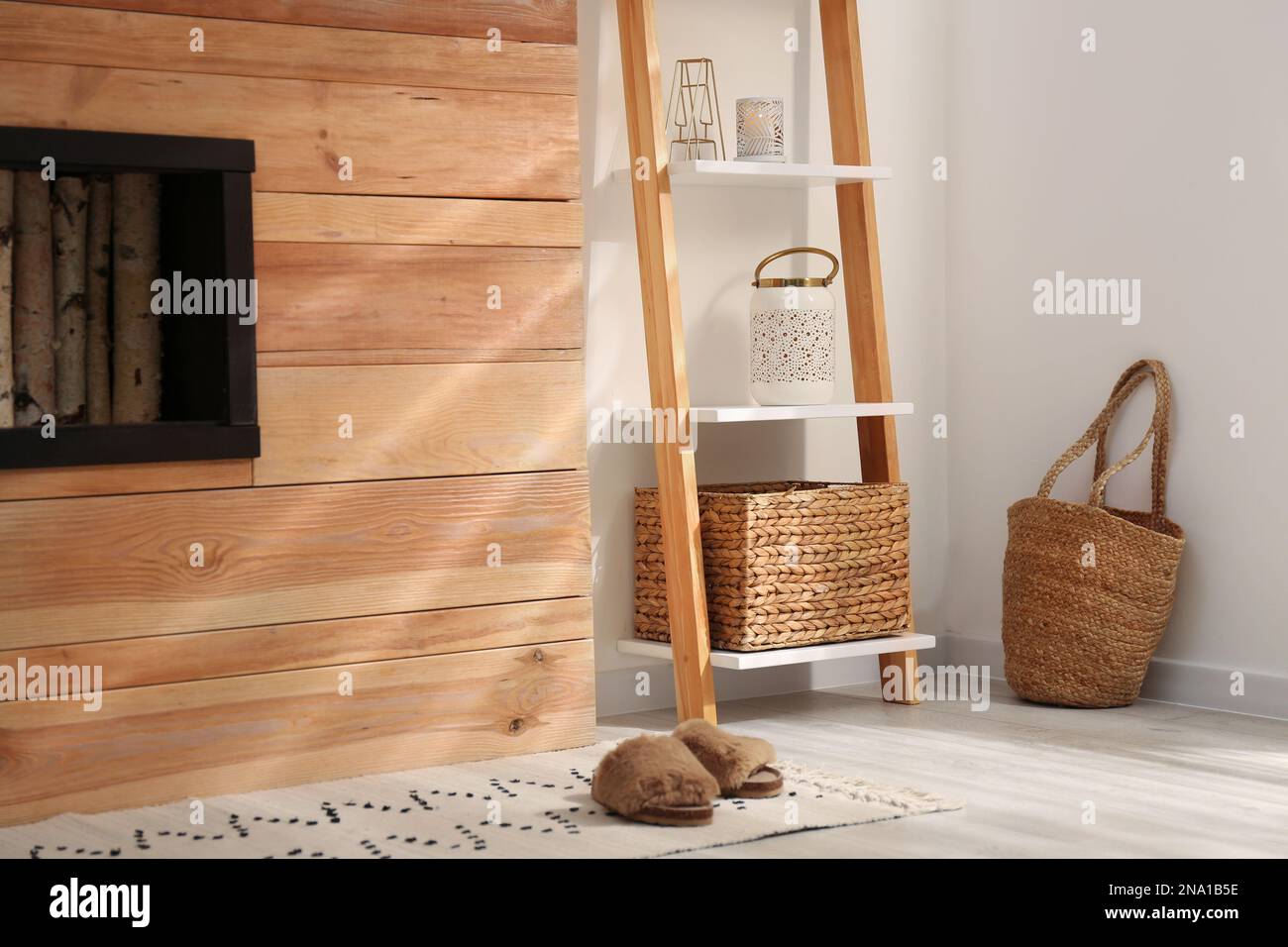 Stylish room interior with wooden ladder near white wall Stock Photo ...