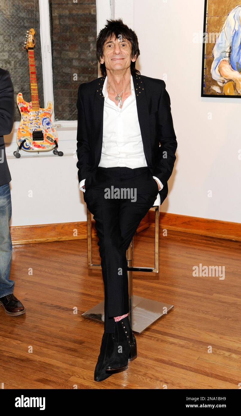 Rolling Stones guitarist Ronnie Wood appears during a news conference ...