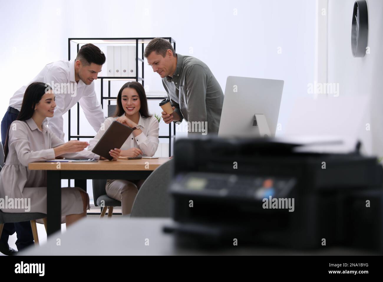 Team group employees tablet hi-res stock photography and images - Alamy