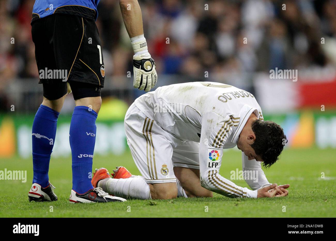 Real Madrid's Cristiano Ronaldo from Portugal lies on the field after ...
