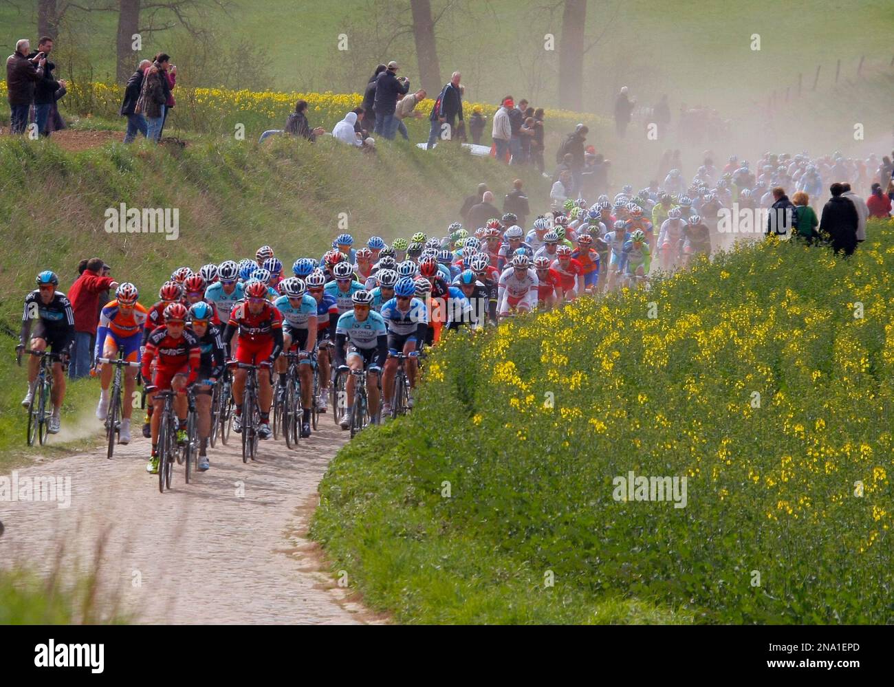 Riders steer their bikes on a cobblestone-paved section during the ...