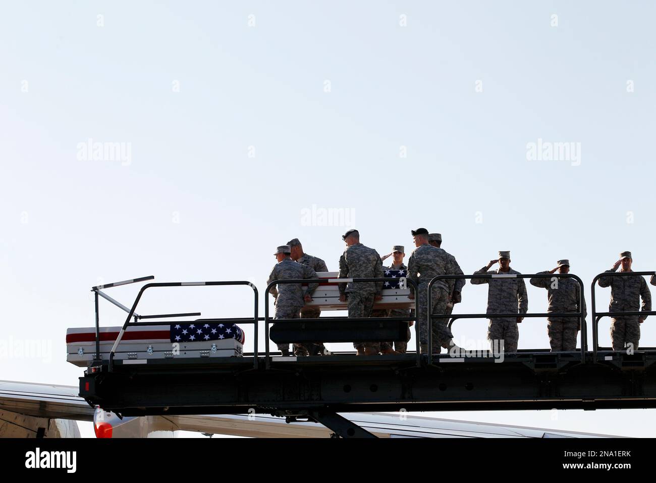 An Army carry team carries the transfer case containing the remains of ...