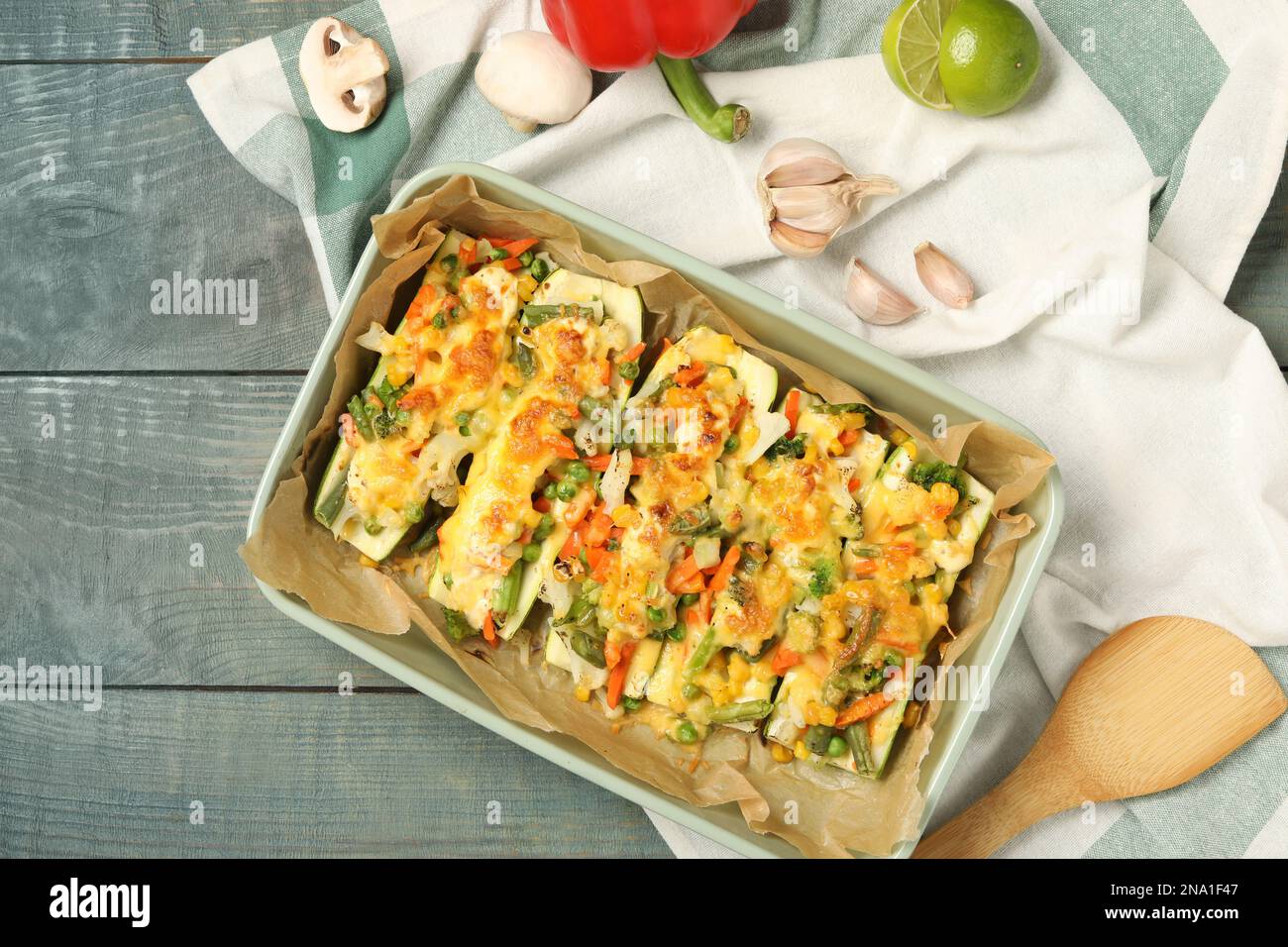 Flat lay composition with stuffed zucchinis on rustic table Stock Photo ...